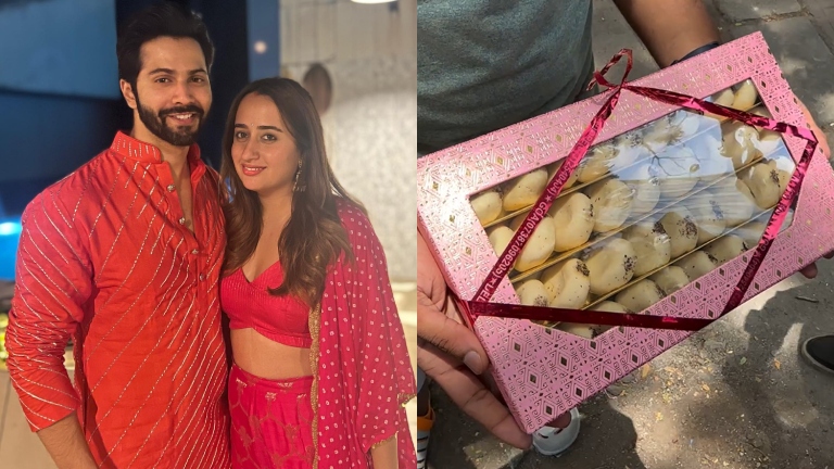 Varun Dhawan distributes sweets to paparazzi after the arrival of baby girl